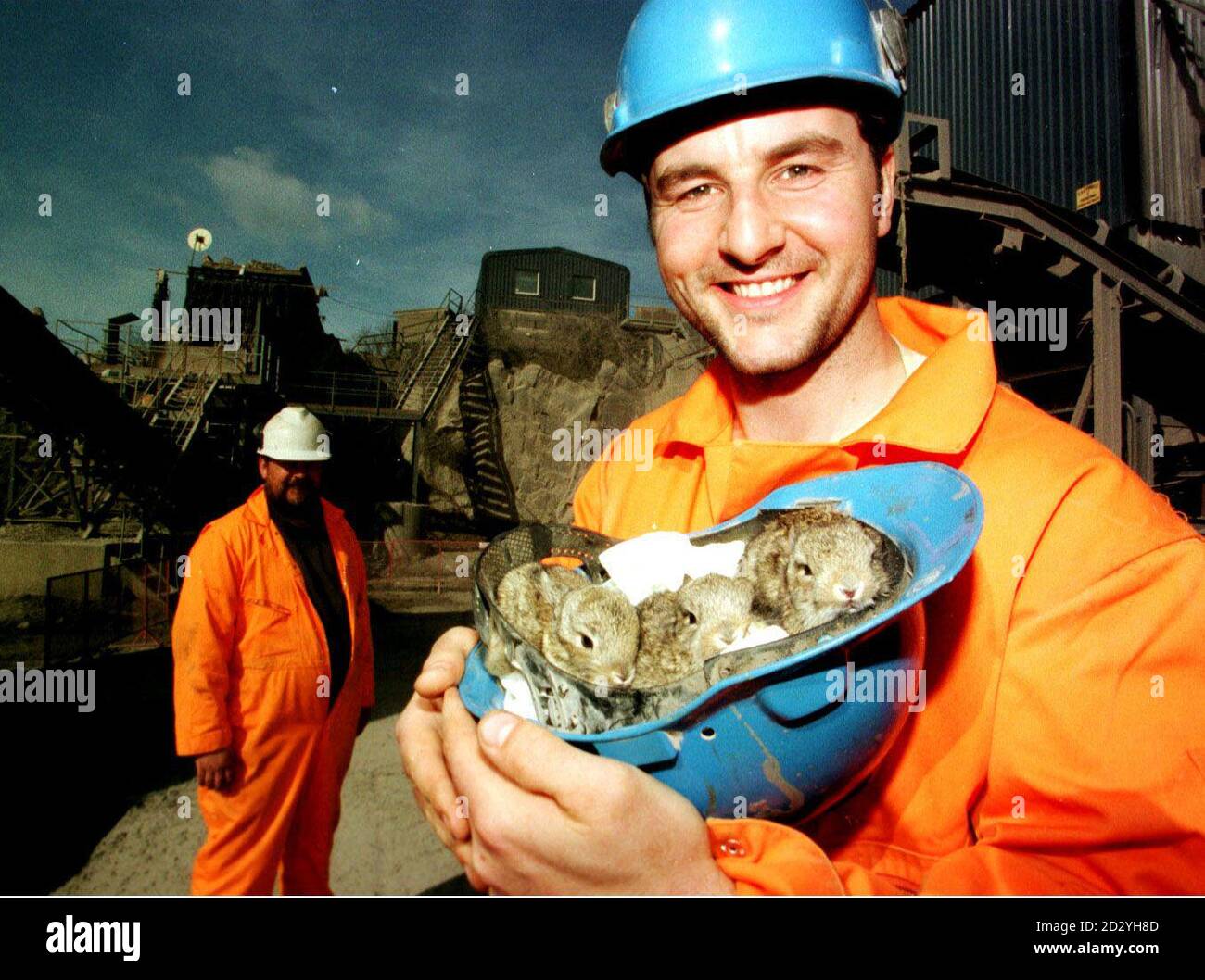 EASTER BUNNIES. Workman Lee Anson, with the trio of orphaned baby ...