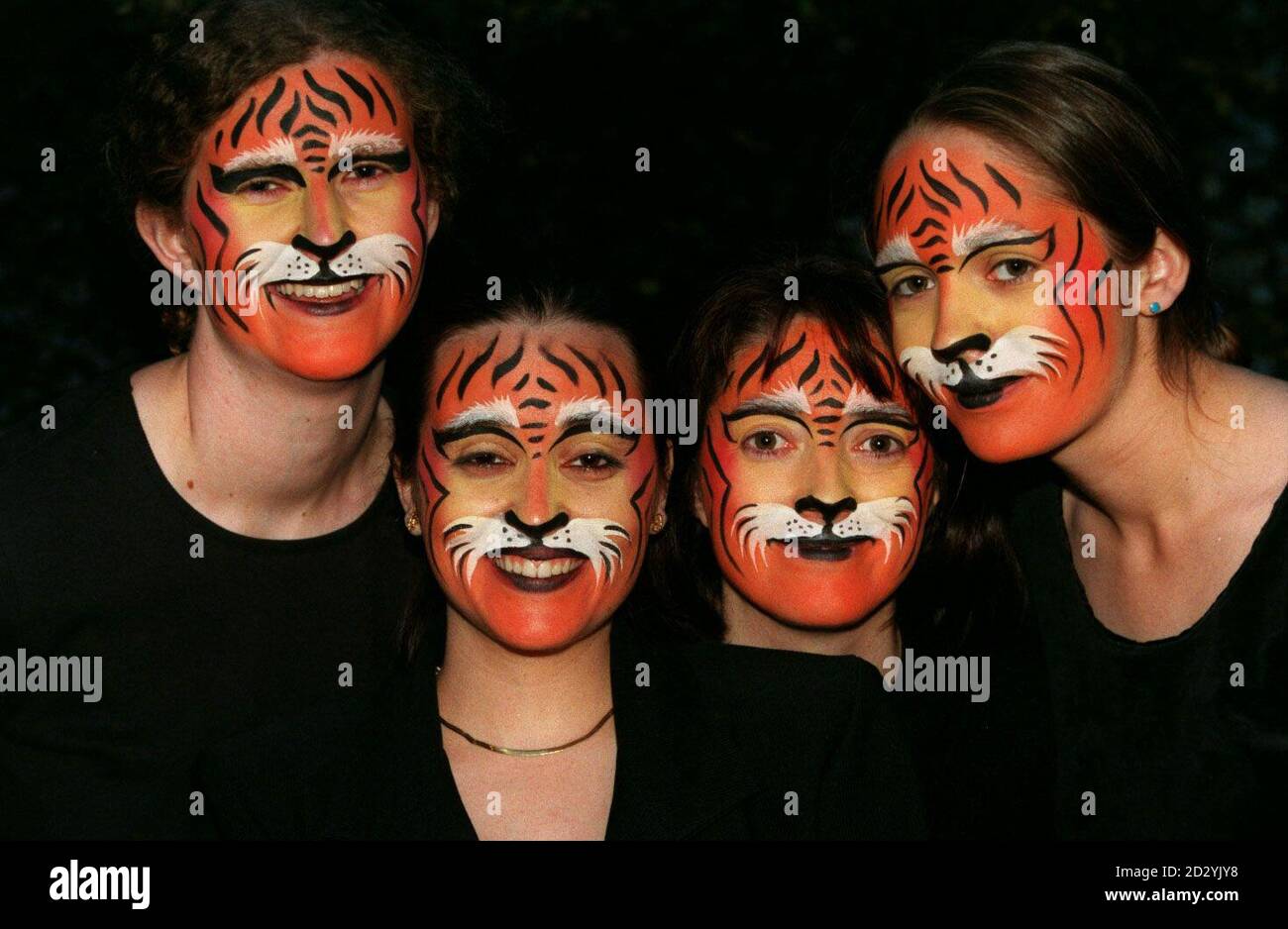 PA NEWS PHOTO 29/4/98 A GROUP OF FEMALE FRIENDS WITH TIGER PAINTED ...