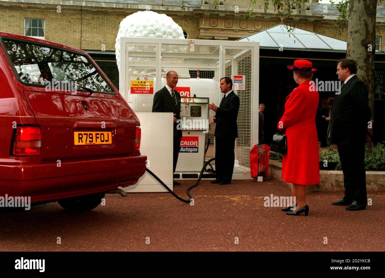 The Queen watches as taxi is refuelled during the launch today ...