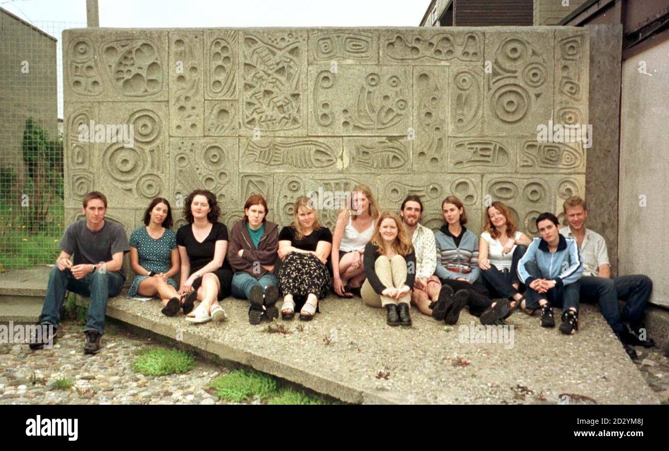 Leeds University Art students on holiday in front of a relief sculpture ...
