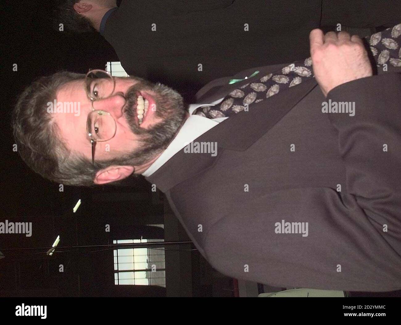 Sinn Fein leader Gerry Adams smiles as he leaves the Kings Hall after ...