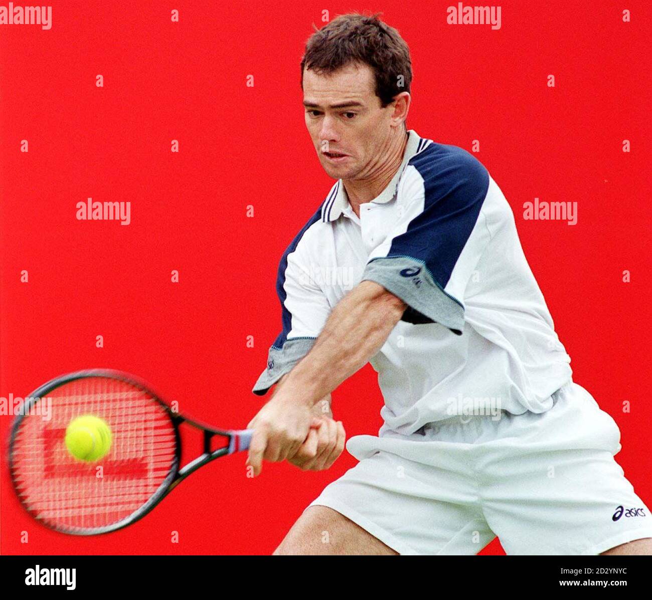 Byron Black from Zimbabwe stretches to make a return to Guillermo Canas ...