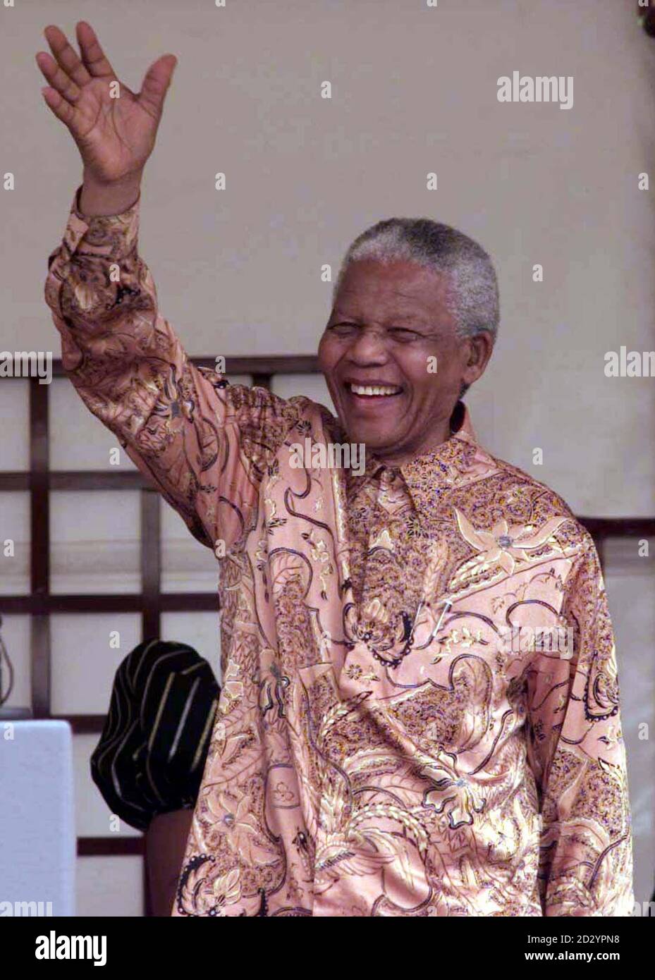 South African President Nelson Mandela waves to the crowds who watched ...