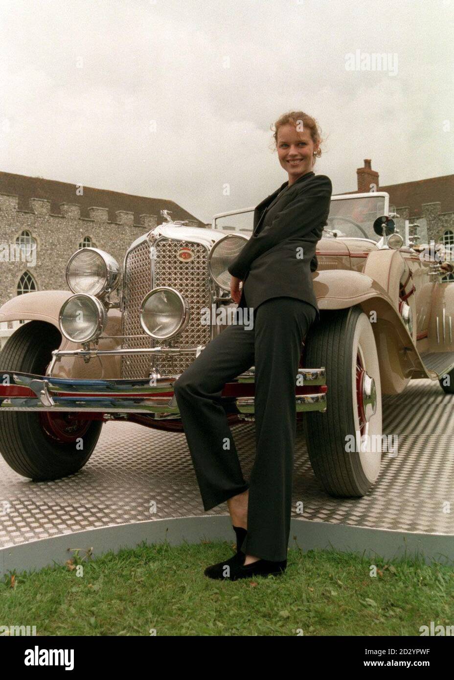 Supermodel Eva Herzigova stands beside a Chrysler CG Imperial during ...