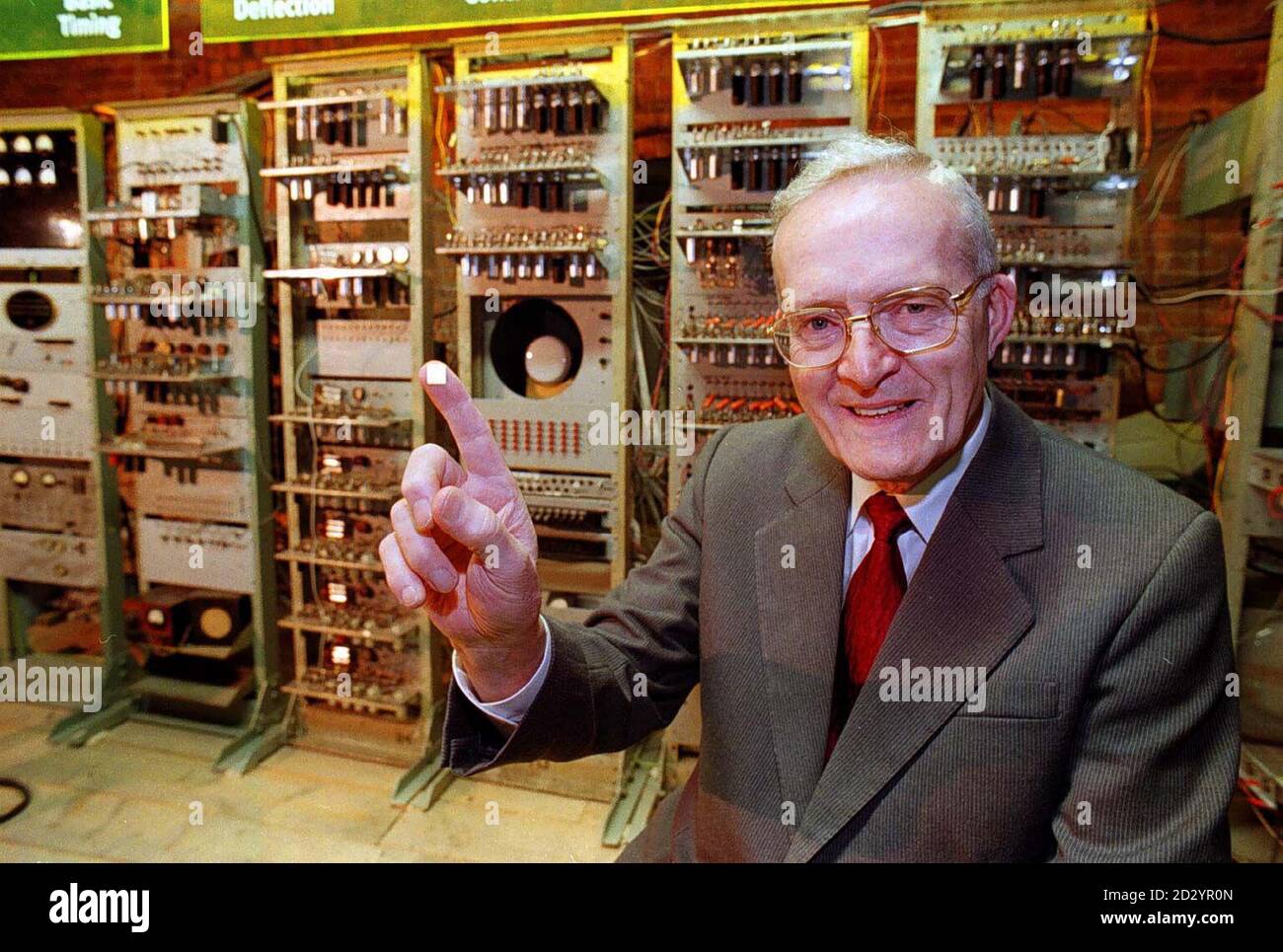 Professor Tom Kilburn with tiny modern day computer 'chip' on his ...