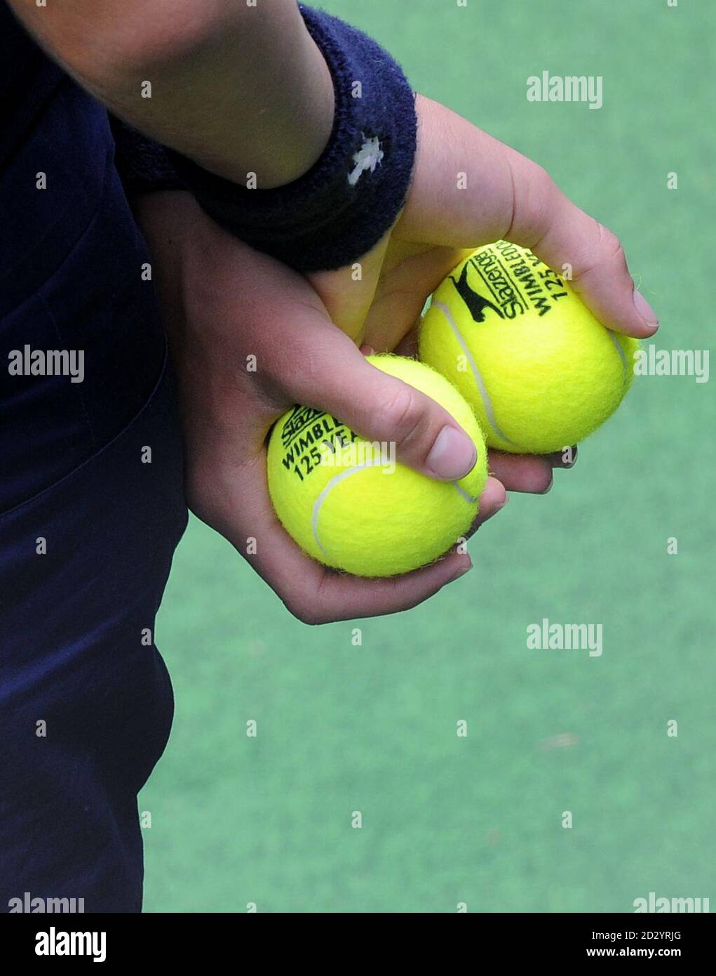 A ball boy holds the balls during day six of the 2011 Wimbledon ...