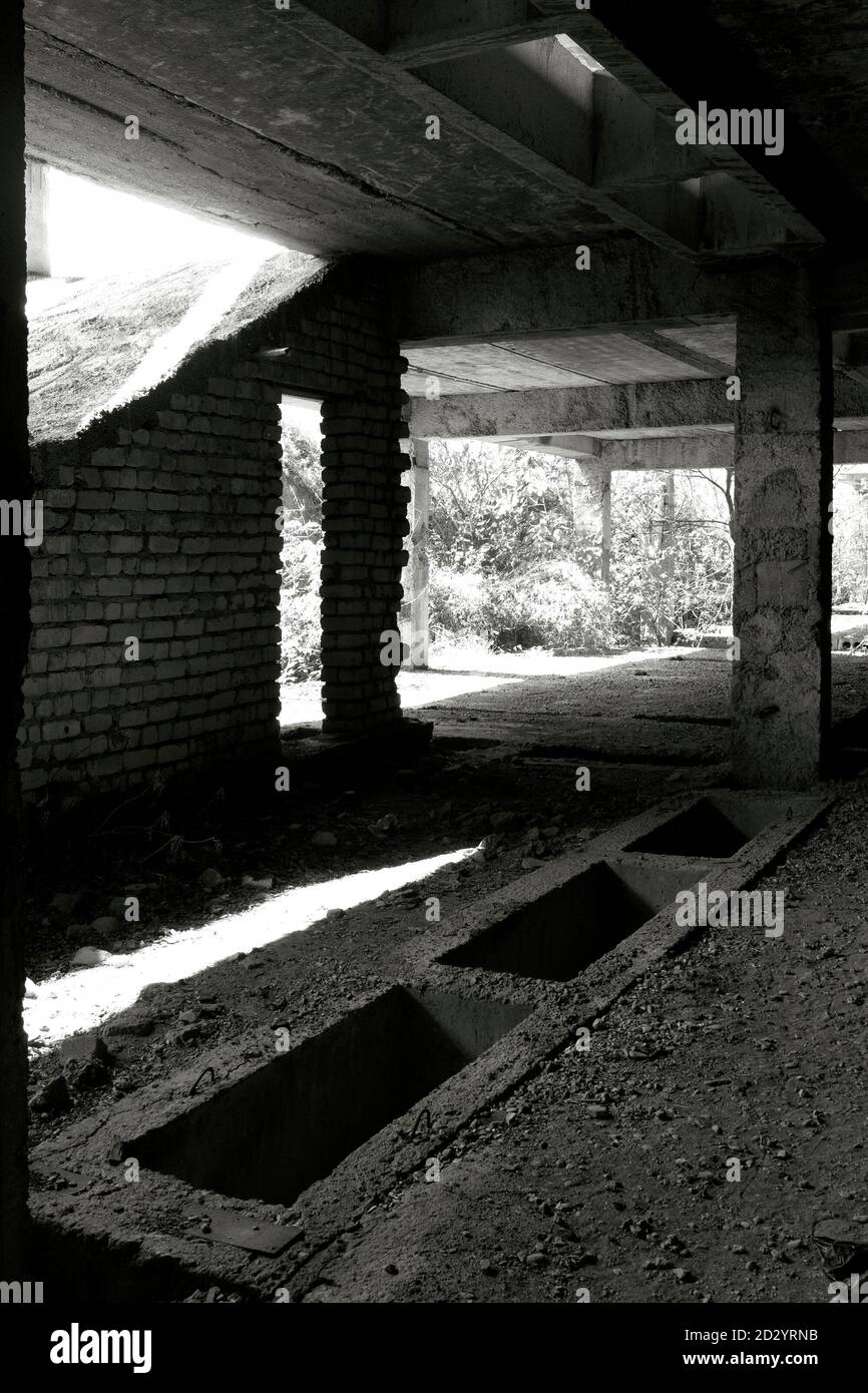 Unfinished and abandoned concrete and brick building. Unfinished ...