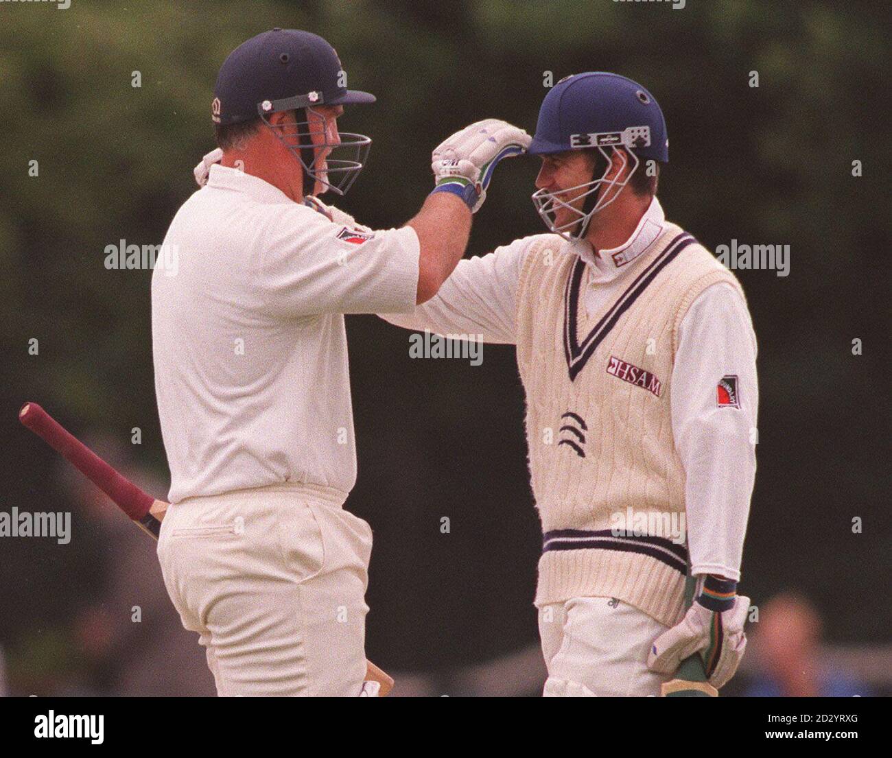 Middlesex openers Mike Gatting (left) and Justin Langer congratulate ...