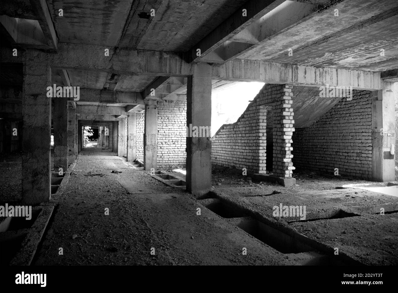 Unfinished and abandoned concrete and brick building. Unfinished ...