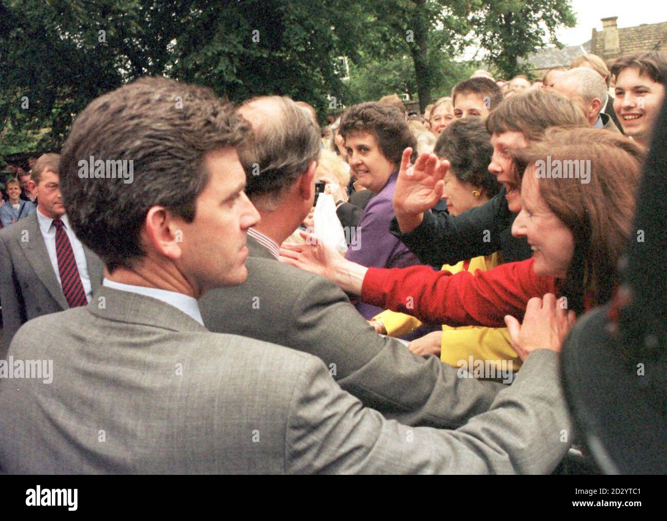 Enthusiastic members crowd grab prince wales on hi-res stock ...