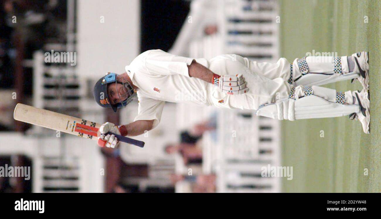 Essex captain Paul Prichard, raises his bat after scoring 50 runs ...
