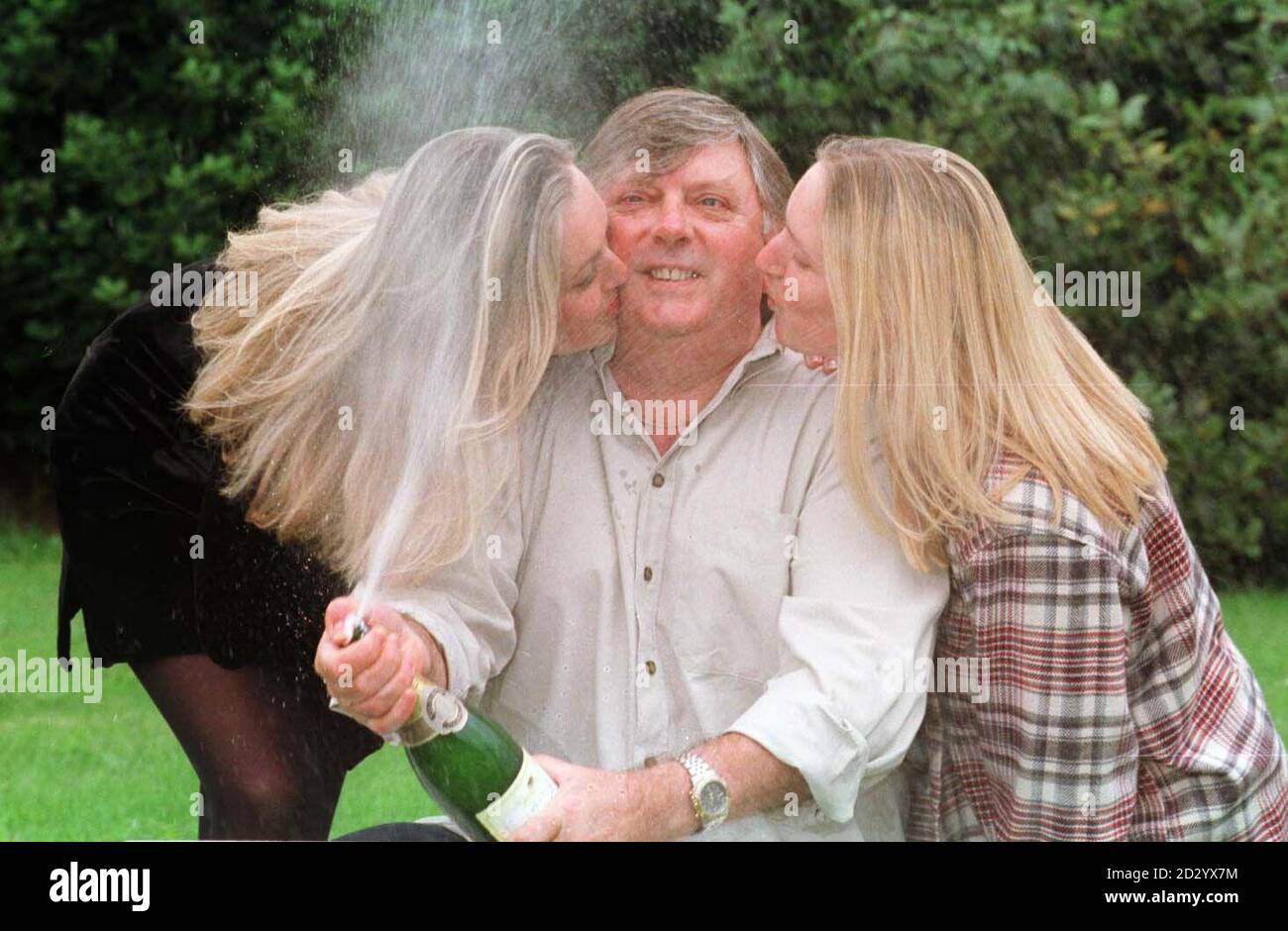 Jeff Rutherford opens the champagne with his daughters Lynne, 29 (left ...