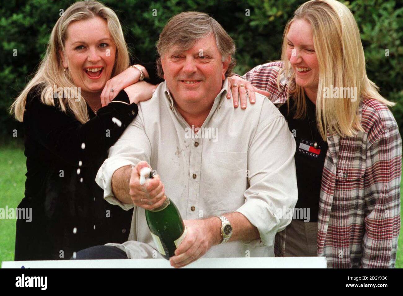 Jeff Rutherford opens the champagne with his daughters Lynne, 29 (left ...