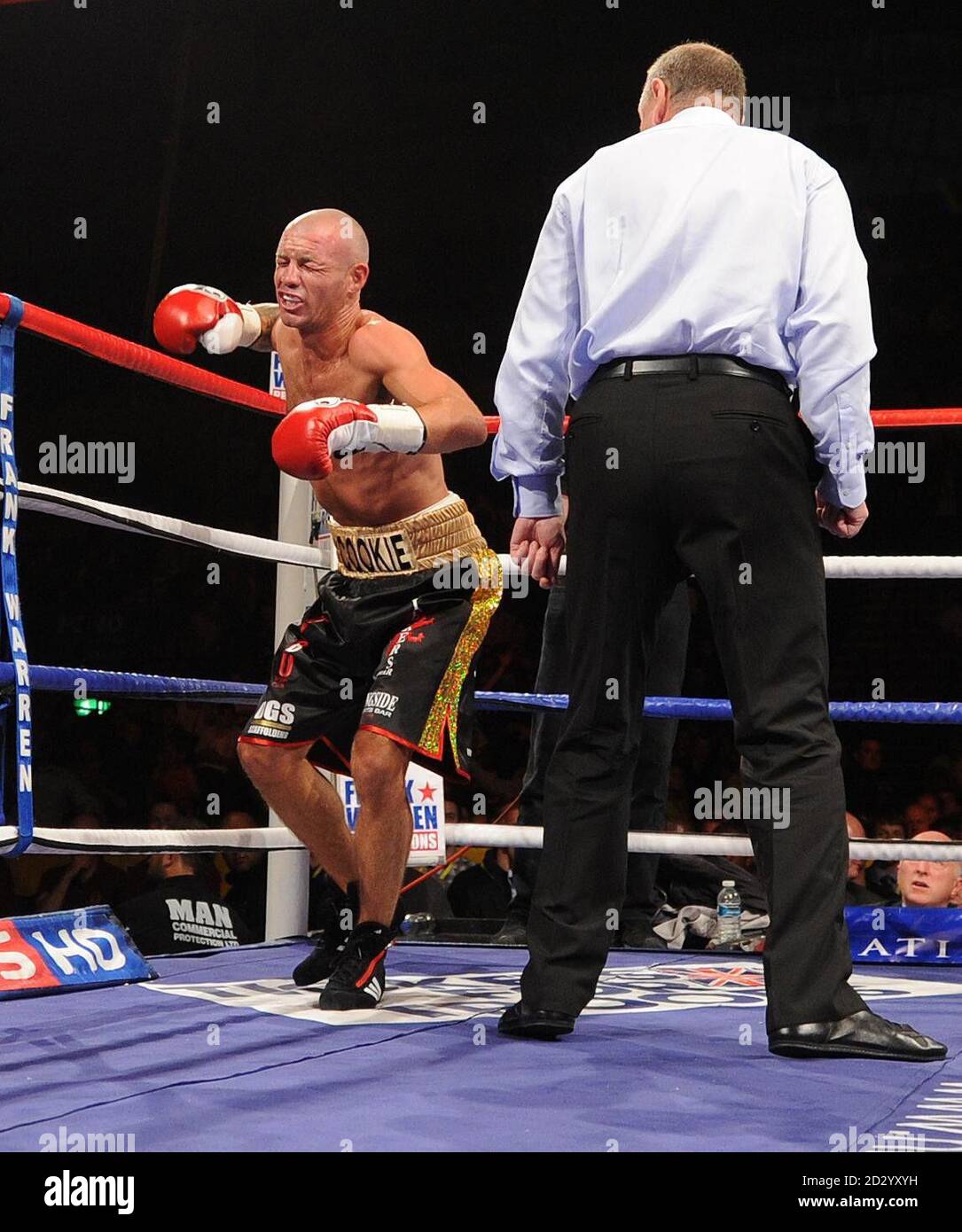 Nicky Cook reacts in pain during the WBO World Super-Featherweight ...