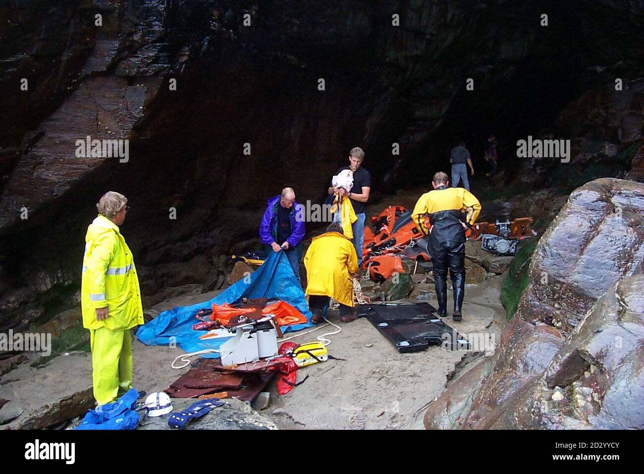 Coastguards and RNLI Crew recover the smashed Lifeboat from the cave at ...