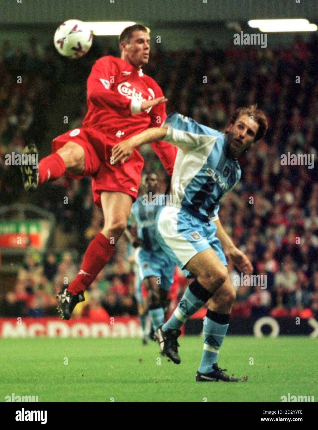 Liverpools Jamie Carragher (left) blocks a Darren Huckerby cross as ...