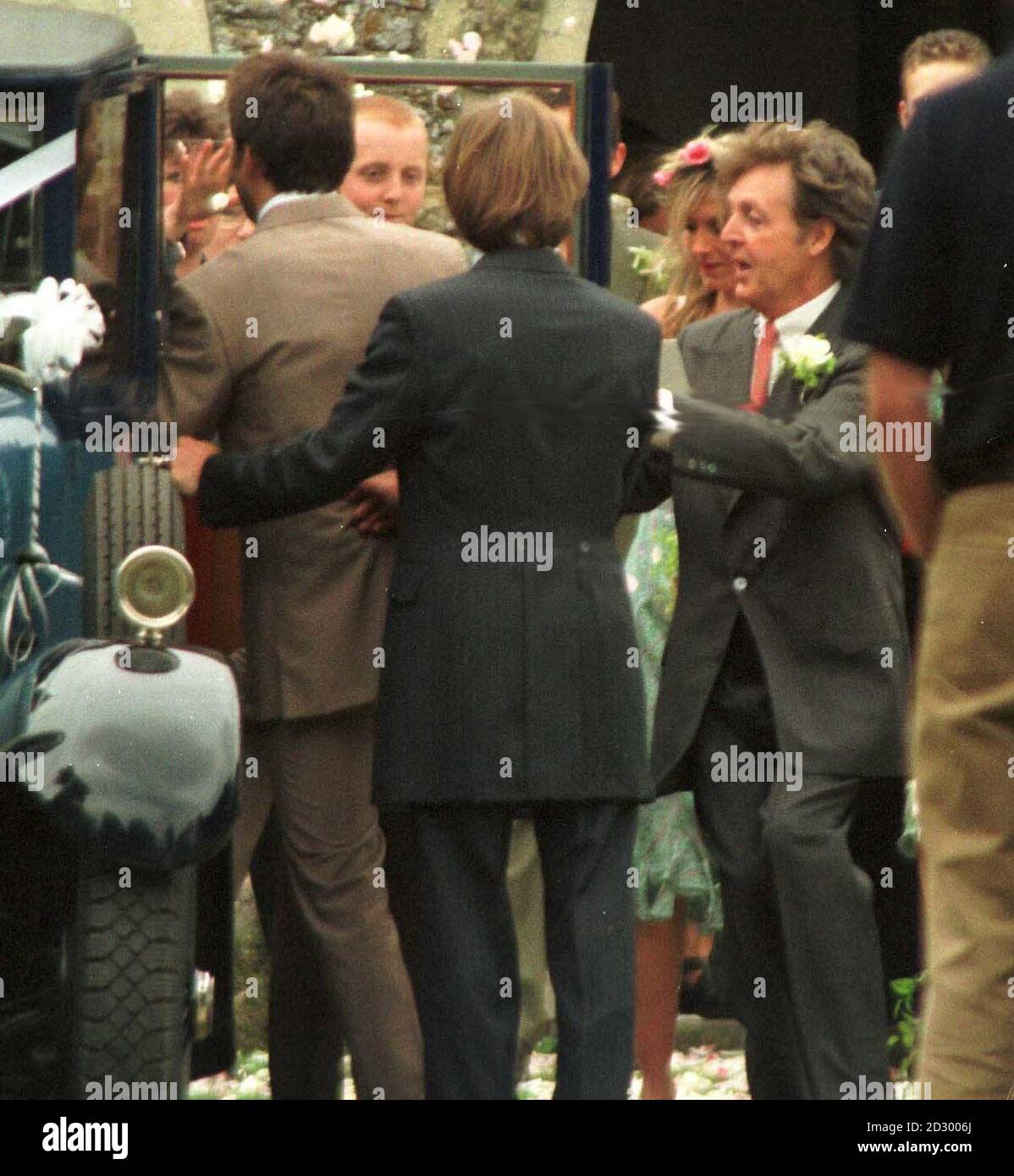Former Beatle Paul McCartney (right) makes his way towards the wedding ...