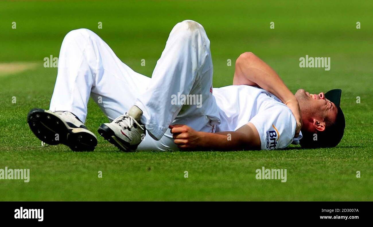 England's Jonathan Trott lies injured during the second npower test ...