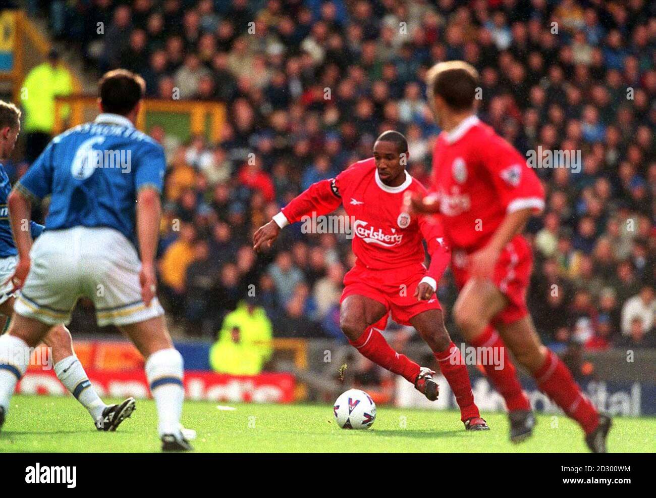 Liverpool captain Paul Ince (centre) makes a break forward against ...