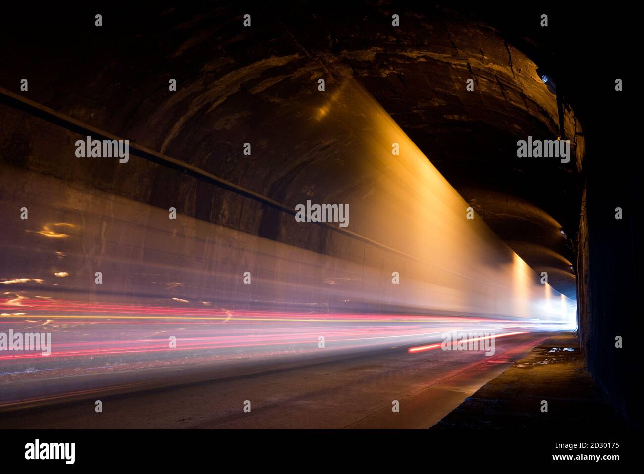 Old dark tunnel with colorful trails of light Stock Photo - Alamy