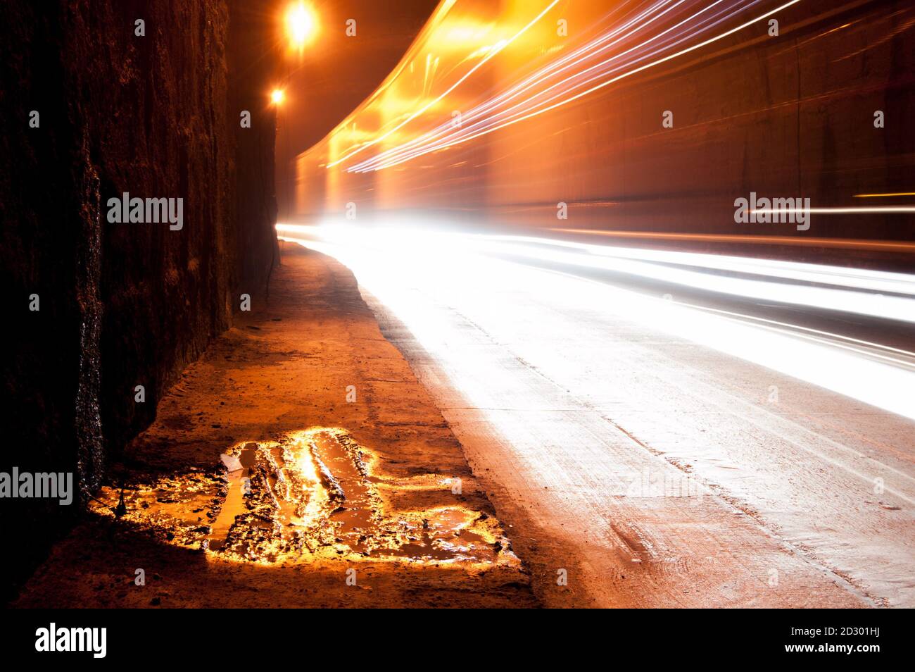 Old dark tunnel with colorful trails of light Stock Photo - Alamy