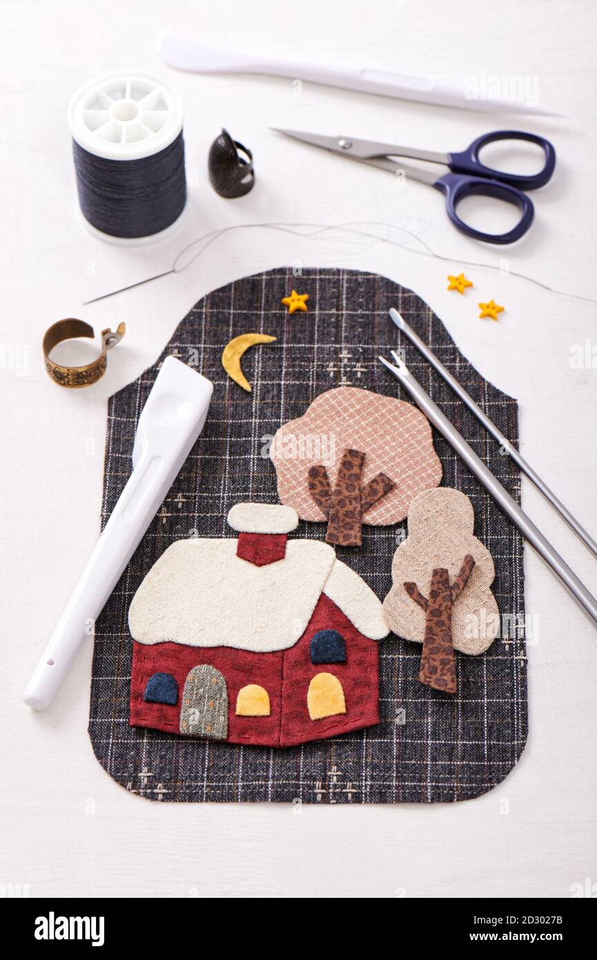 Applique tools for fabric and detail of applique Stock Photo - Alamy