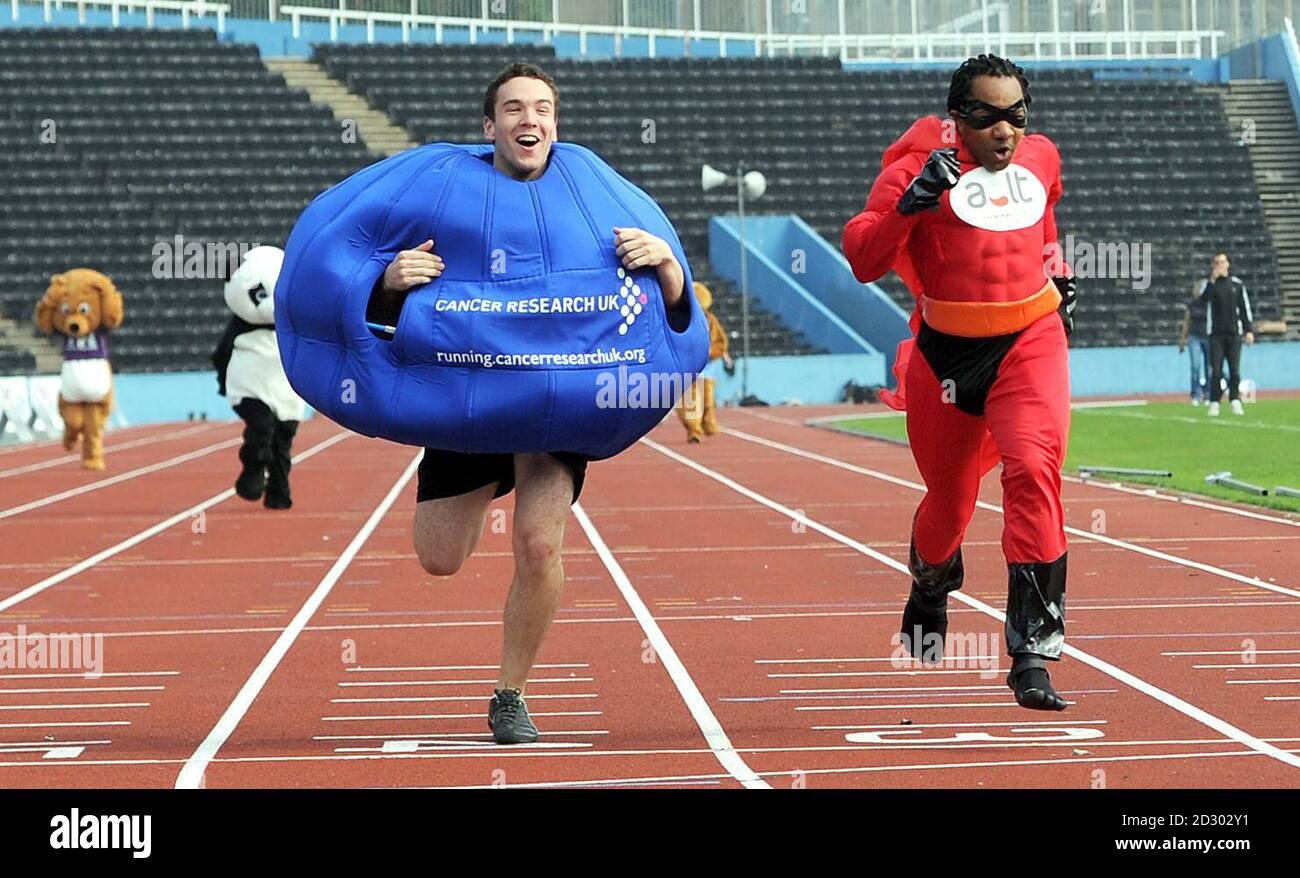 Wendell K Raphael dressed as mascot Super Donor Dan (right) beats Nick ...