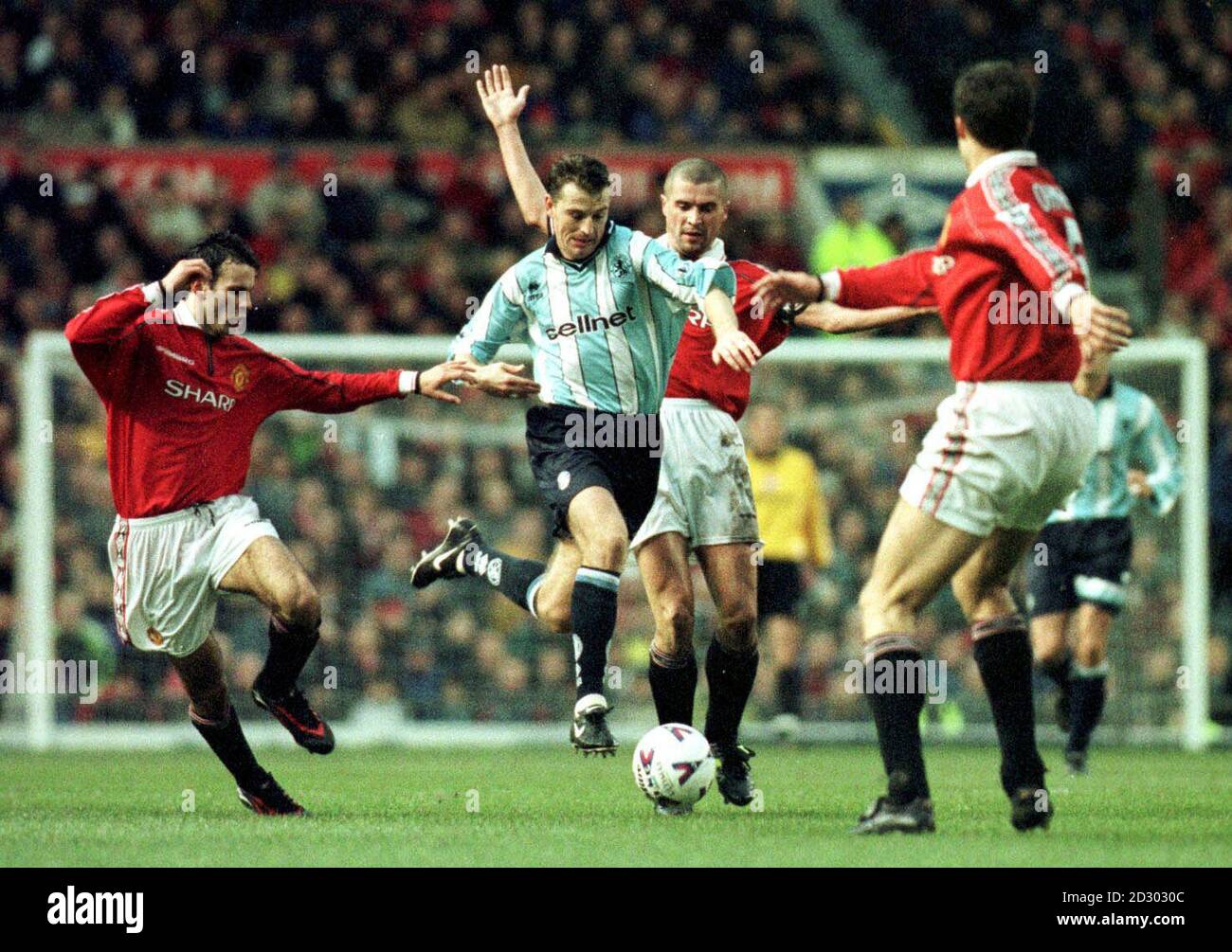Middlesbrough's Colin Cooper cuts through the Manchester United defence ...
