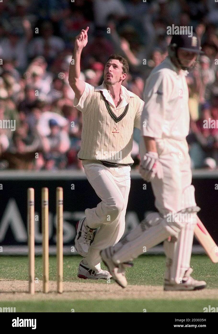 Australia's Damien Fleming gestures after bowling England's Michael ...