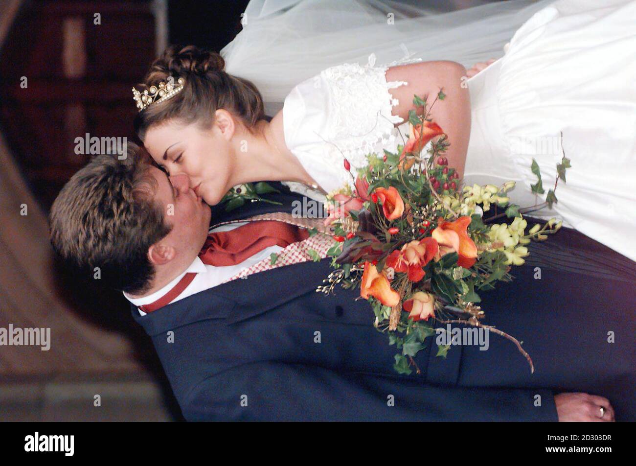 Golfer Lee Westwood kisses his bride Laurae Coltart after their wedding ...