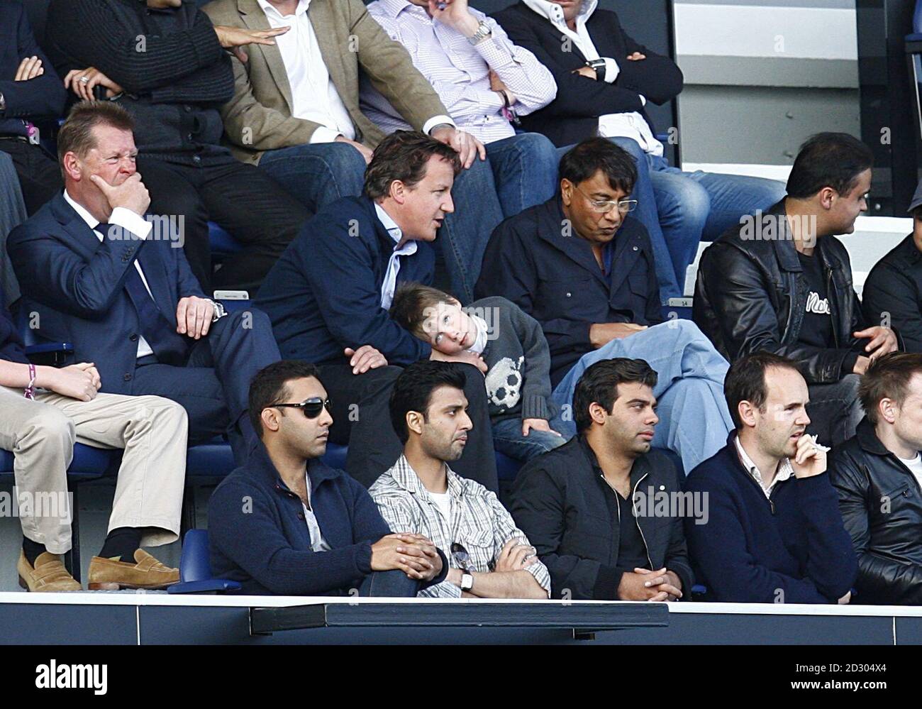 Prime Minister David Cameron with his son Arthur (centre) at the match ...