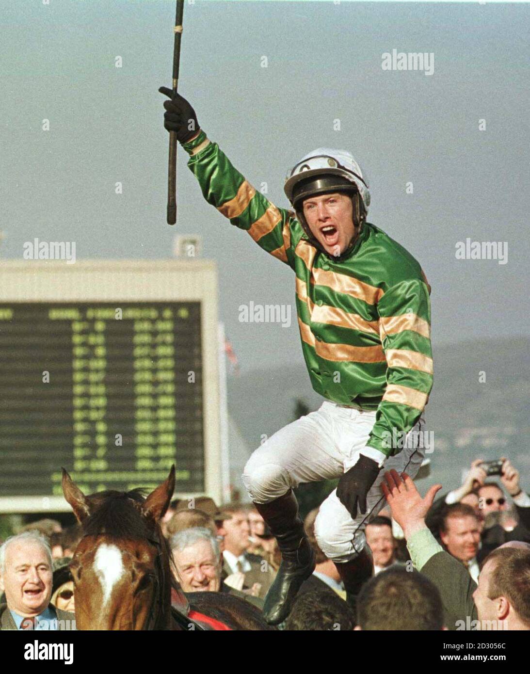 Charlie Swan dismounts from Istabraq after winning the Smurfit Champion ...