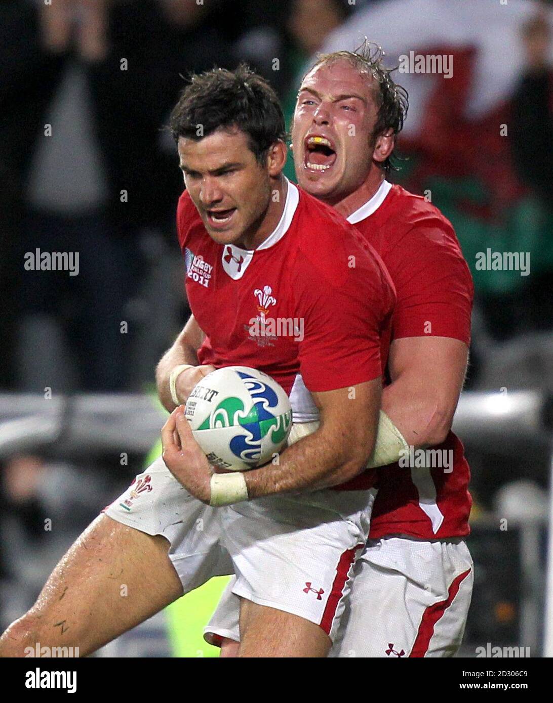 Wales' Mike Phillips (left) celebrates with his team-mate Alun Wyb ...