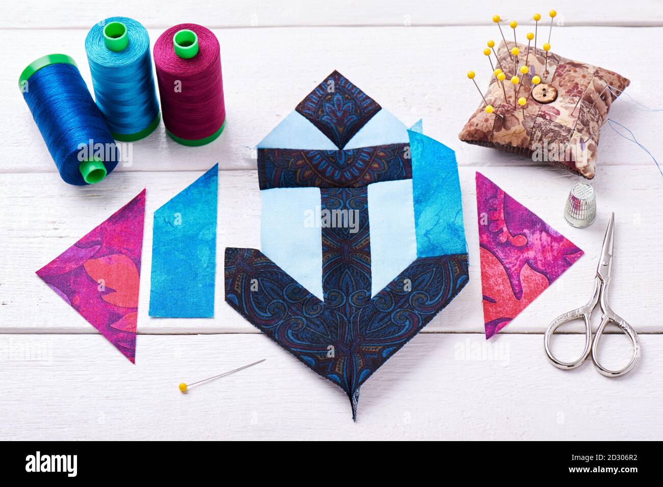 Sewing patchwork of block anchor surrounded by accessories Stock Photo ...