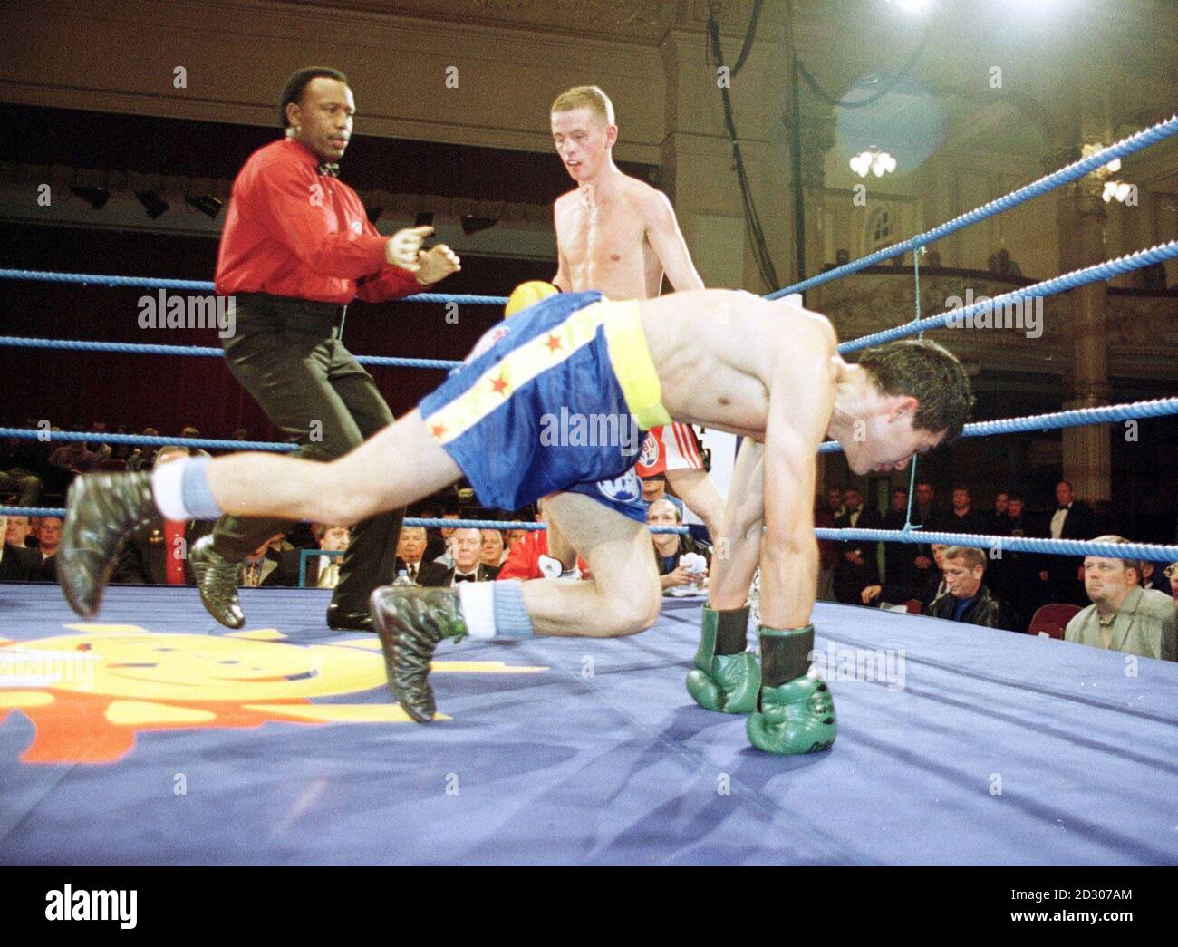 Peter Culshaw (centre) and Adrian Ochoa during their title fight at The ...