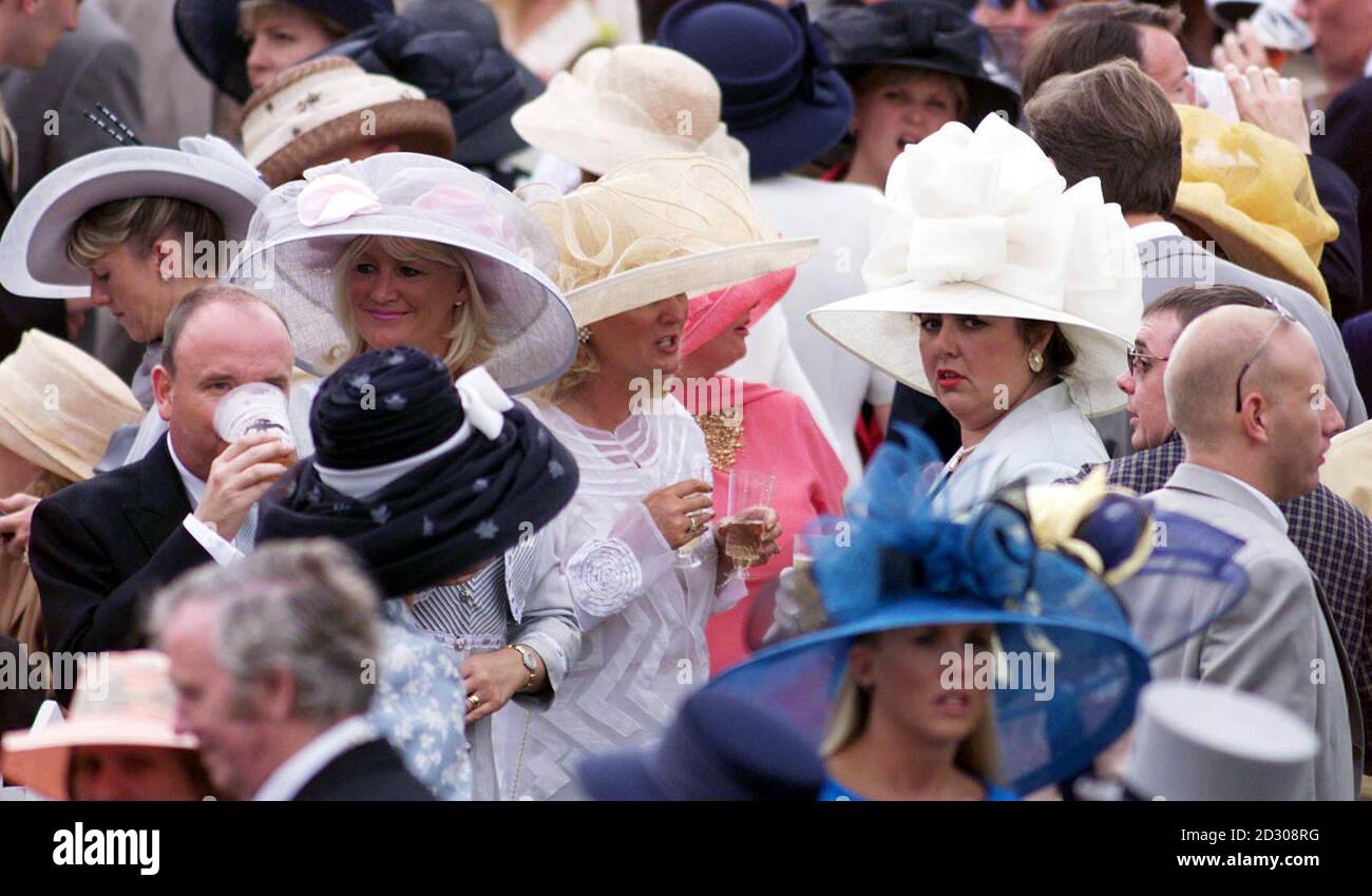 A selection of ladies and gentlemen parade in the paddock enclosure ...