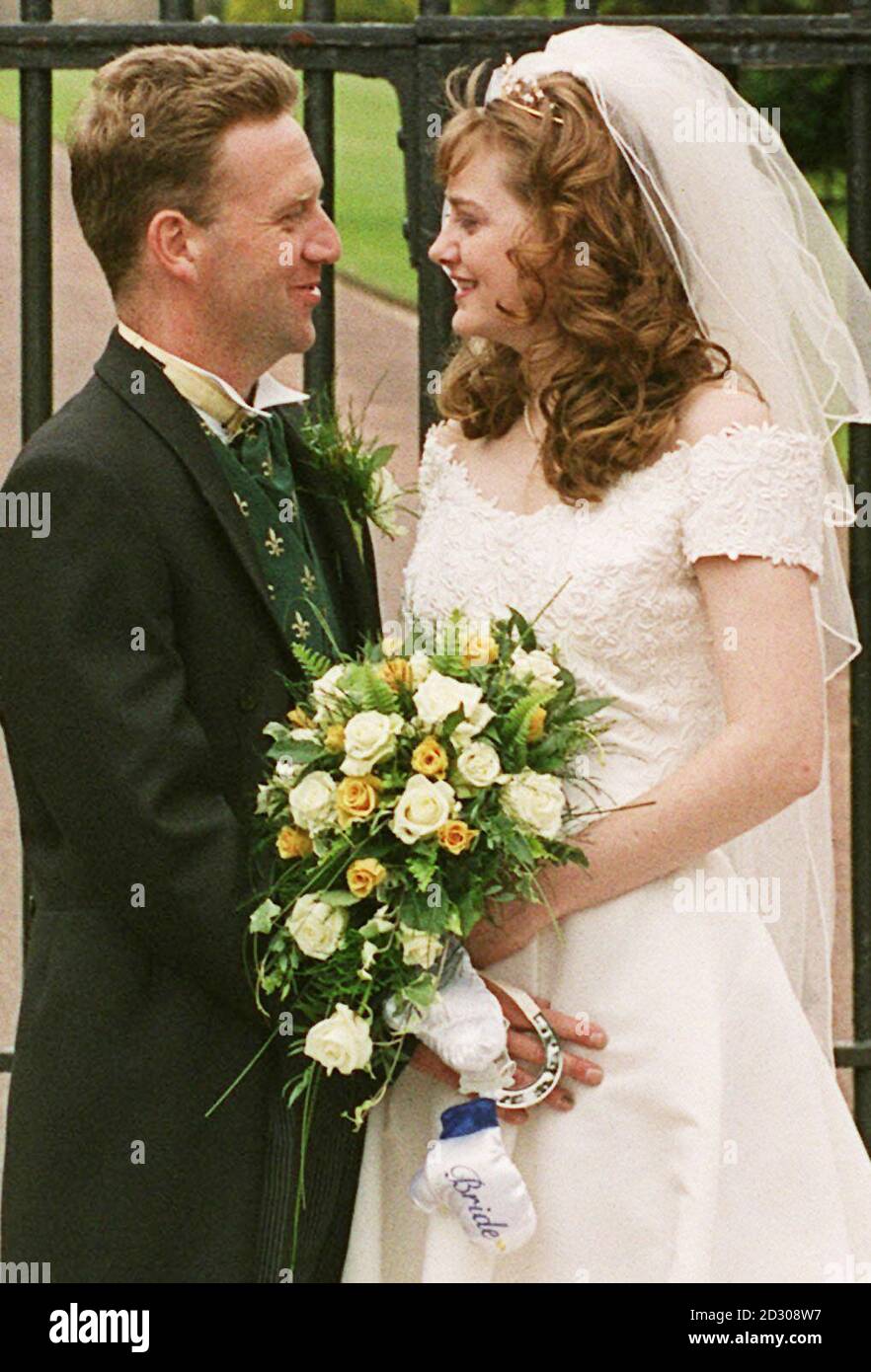 Susan Arthur and her husband Chris Rogers stand outside the gates of ...