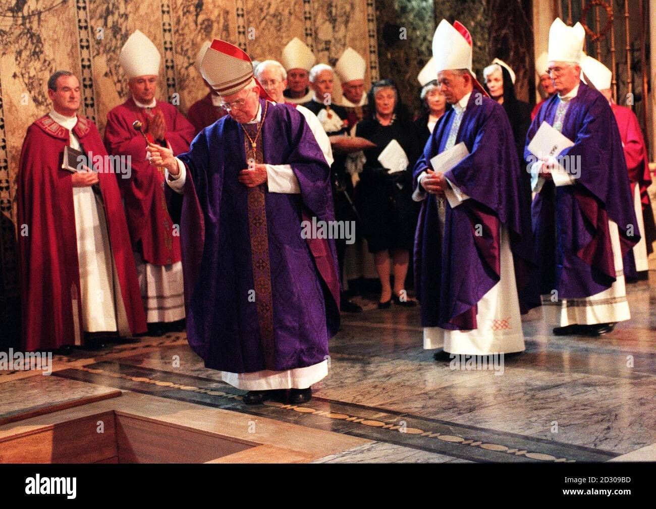 The former Archbishop of Armargh, Cardinal Cahal Daly, sprinkles the ...