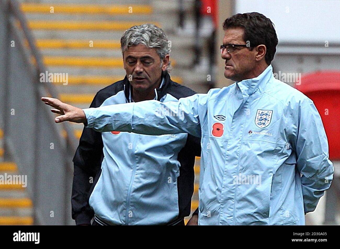 England's manager Fabio Capello speaks with General Manager Franco ...