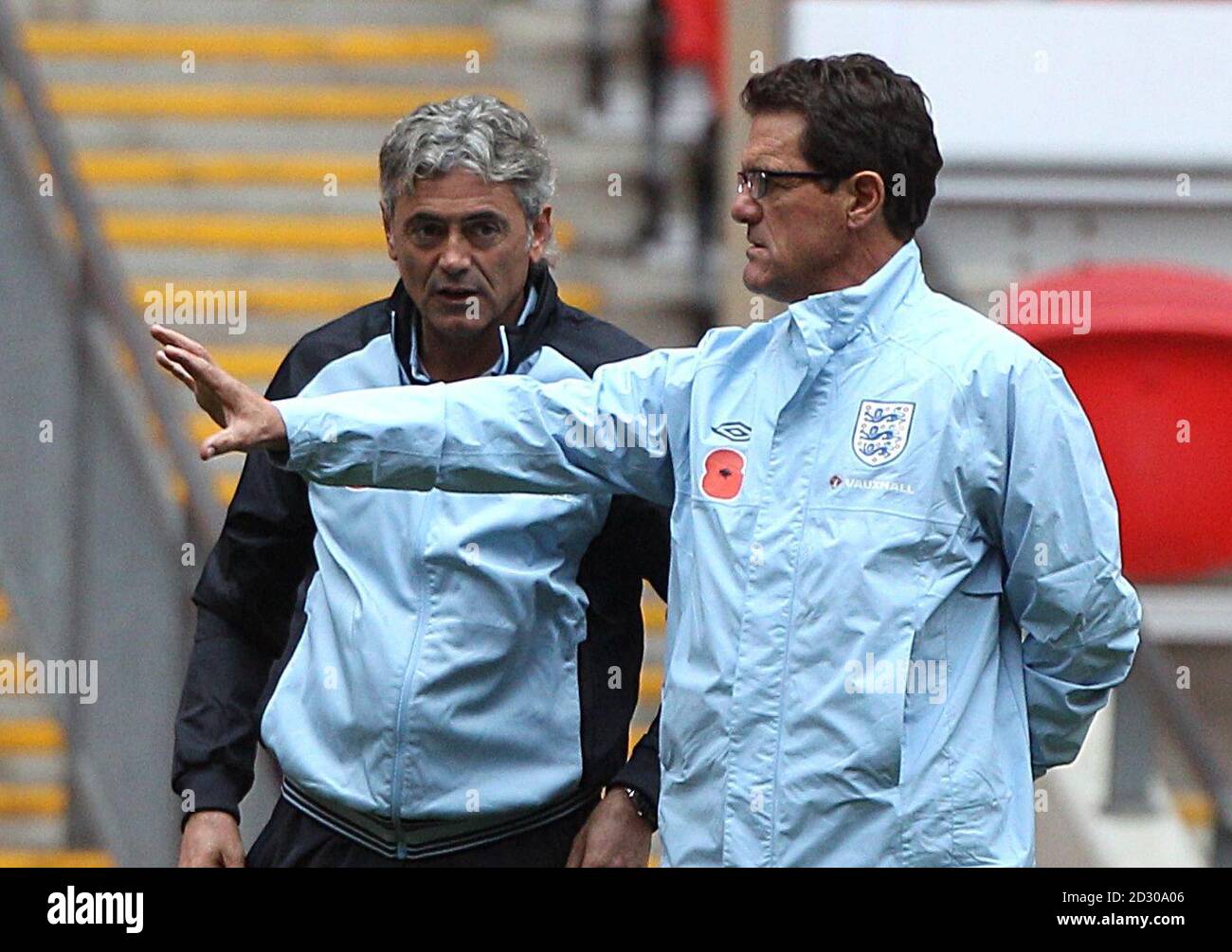 England's manager Fabio Capello speaks with General Manager Franco ...