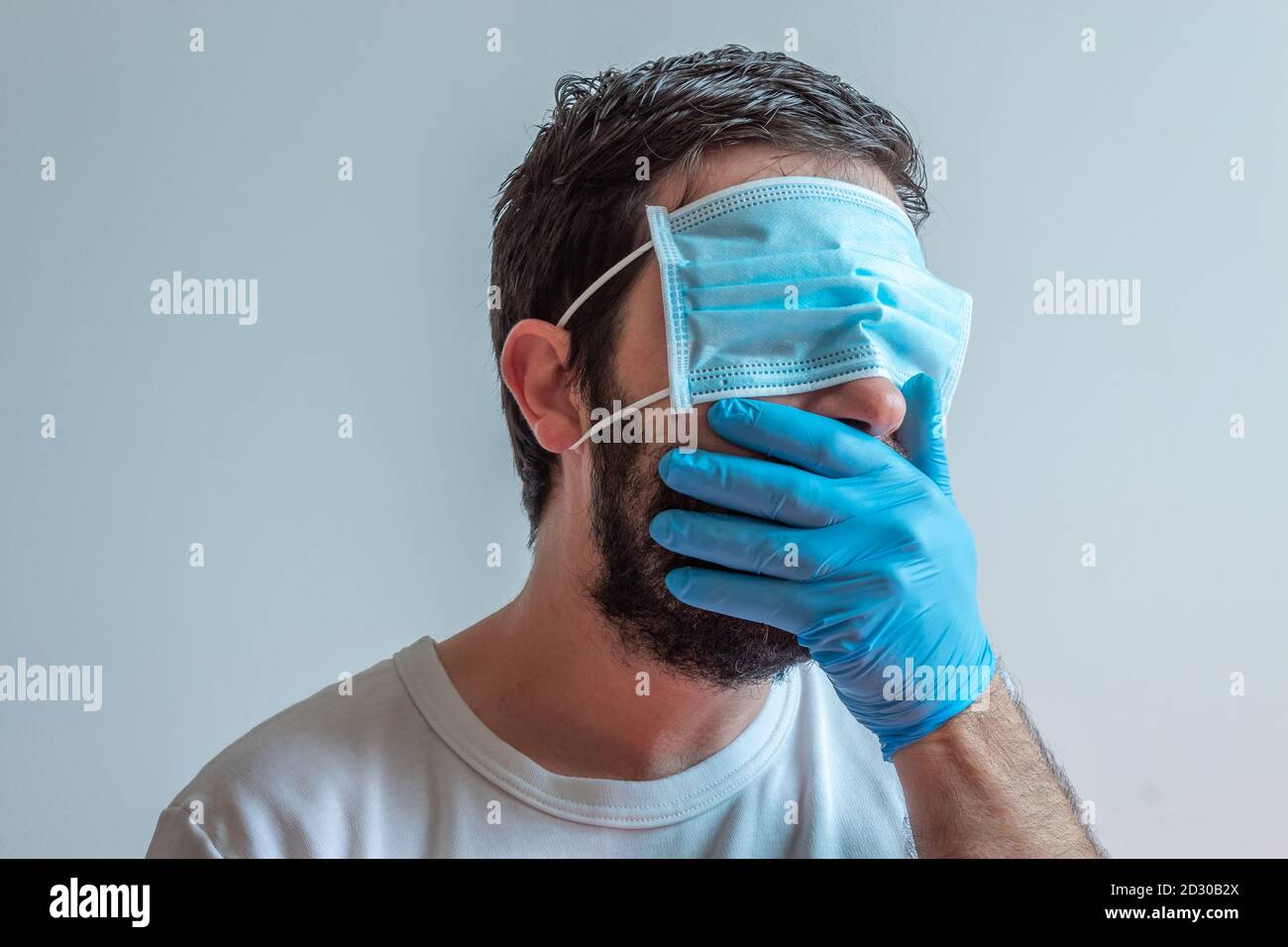 Closeup shot of a male wearing a face mask over his eyes - the concept ...