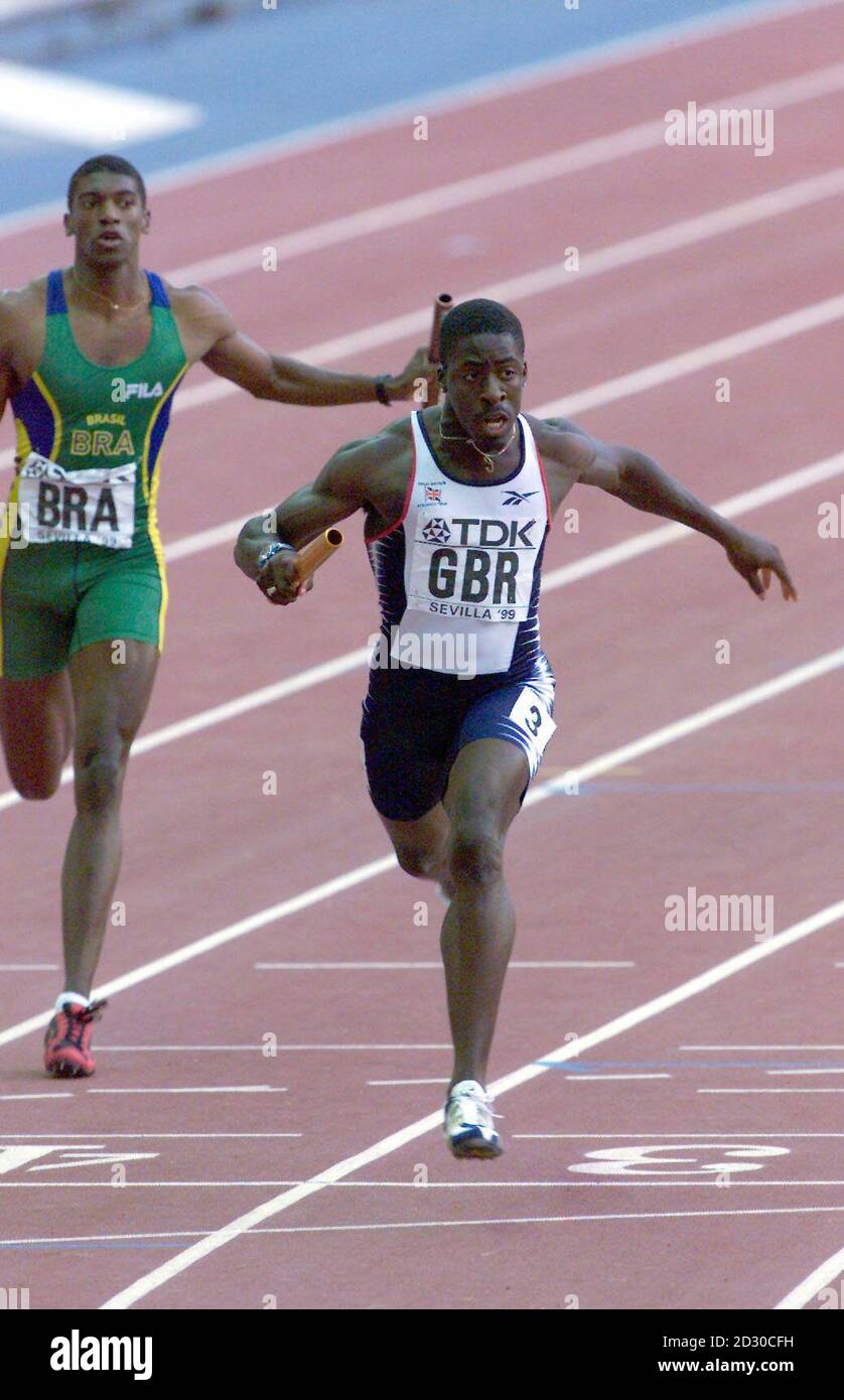 Britain's Dwain Chambers crosses the line winning silver in the 4 x ...
