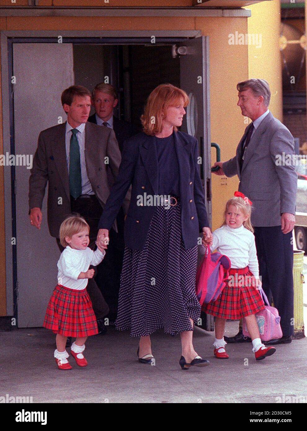 The Duchess of York, with her two children, Princess beatrice (L) and ...