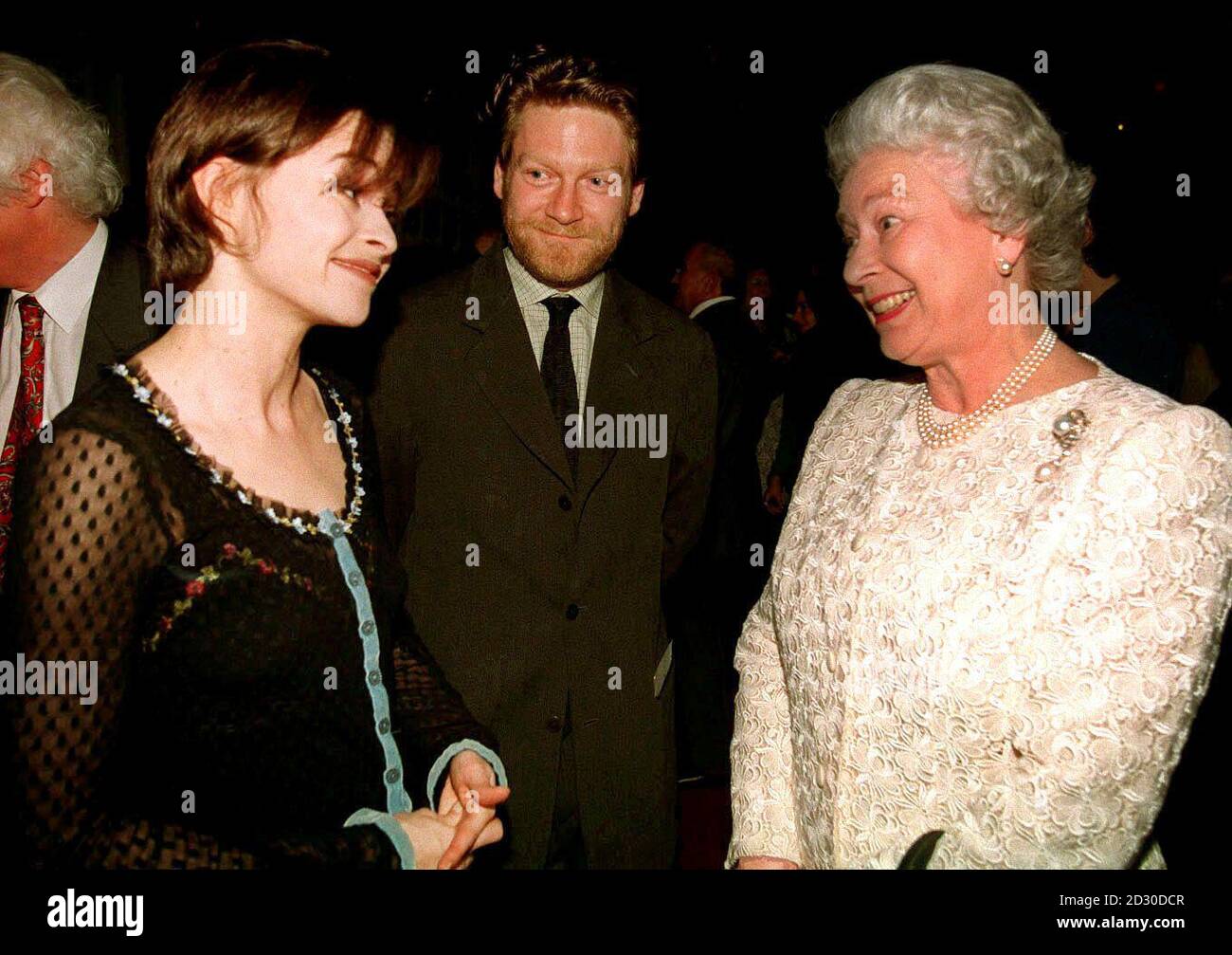 Helena Bonham Carter (left) and Kenneth Branagh chat to Britain's Queen ...