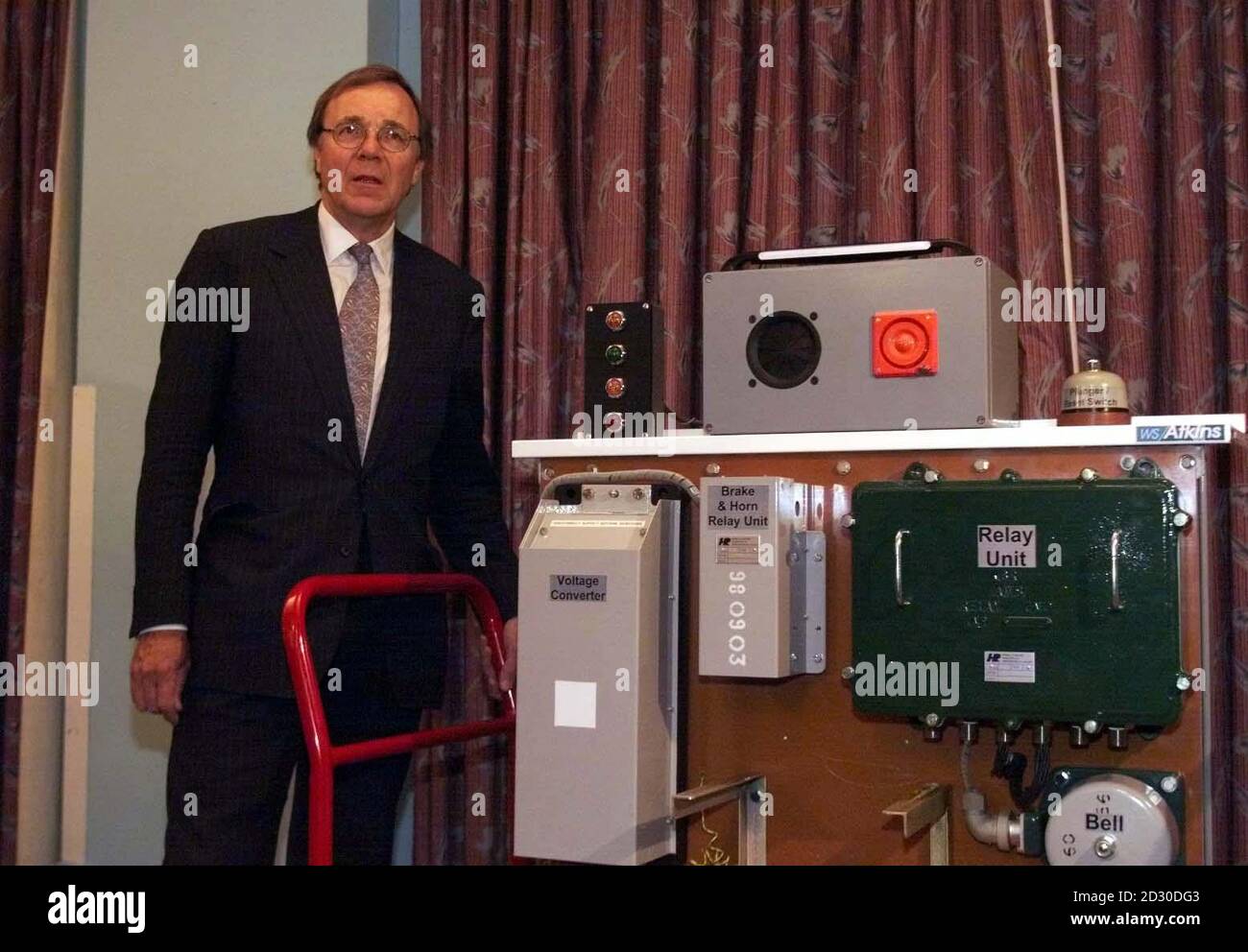 Professor John Uff explains train safety equipment during a press ...
