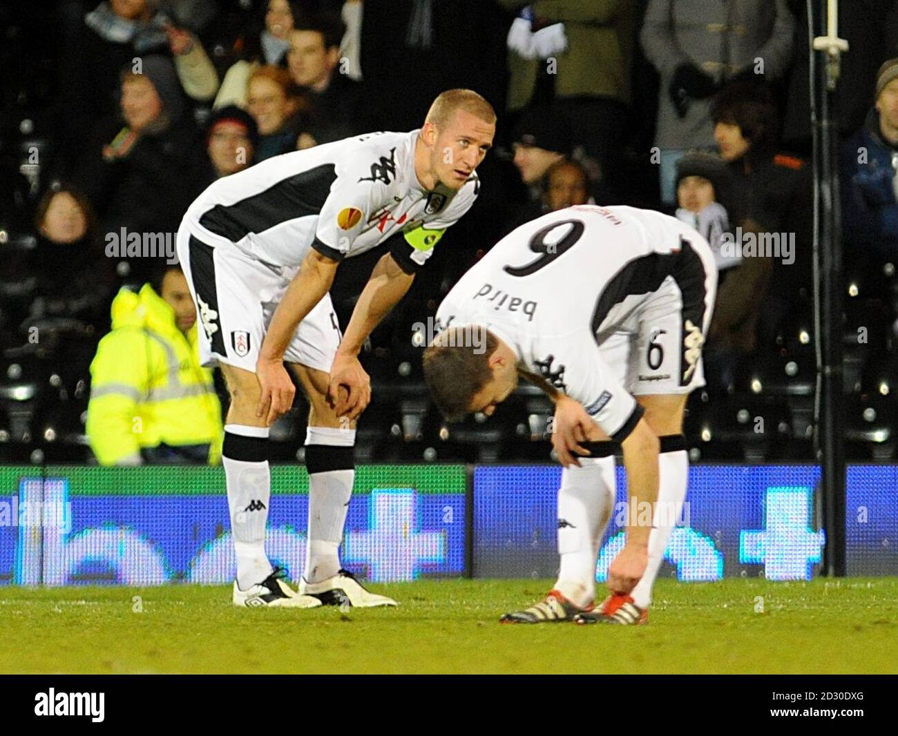 Fulham's Brede Hangeland (left) and Chris Baird stand dejected Stock ...