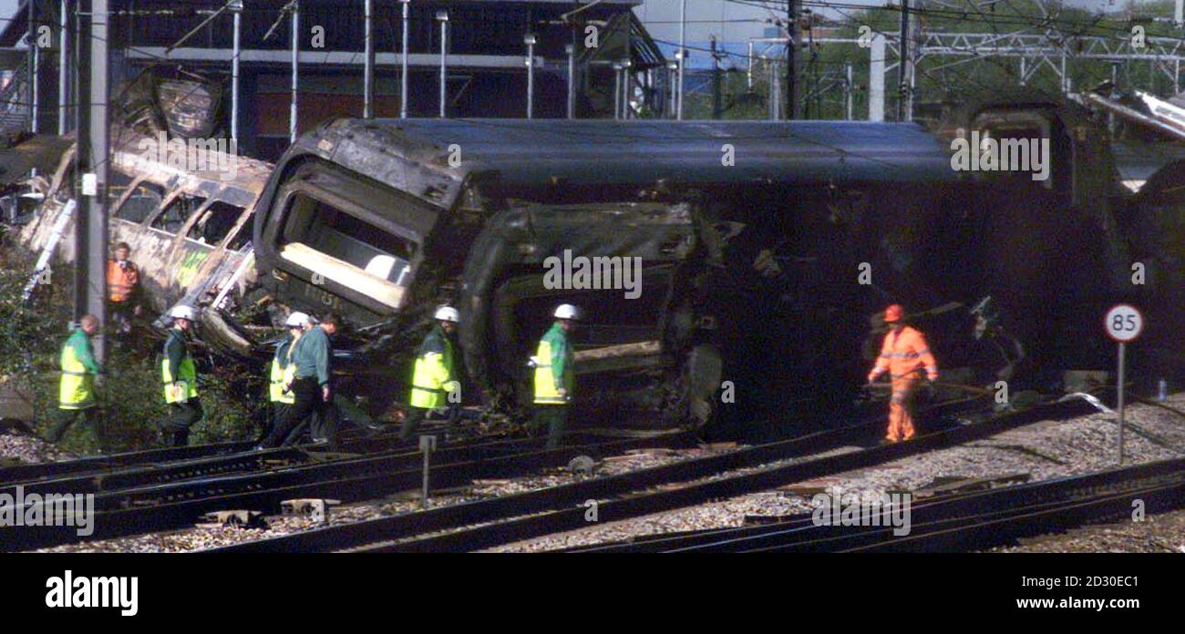 The wreckage of two trains lie on rails in west London after a crash. A ...
