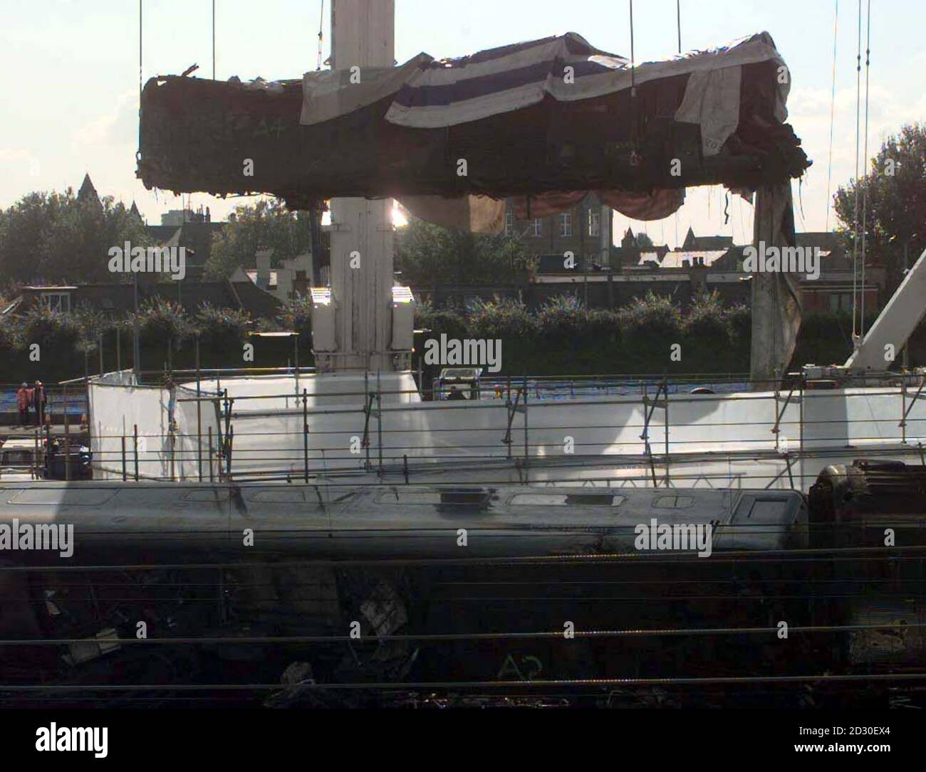 The wrecked and burnt out Great Western train carriage H is lifted from ...