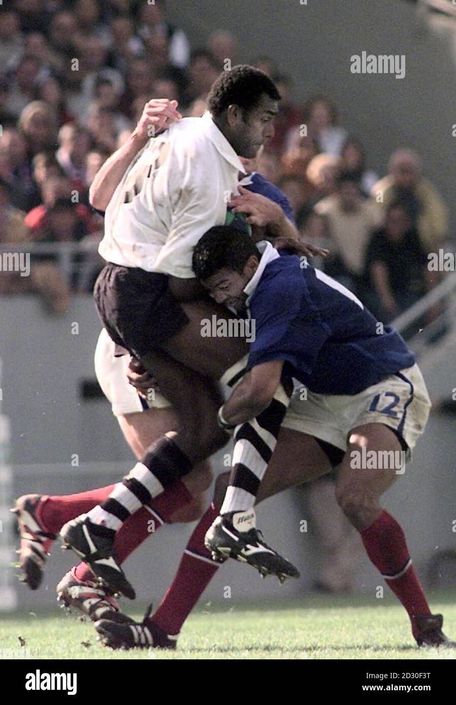 France's Emile Ntamack put a stop to the progress of Fiji's Viliame ...