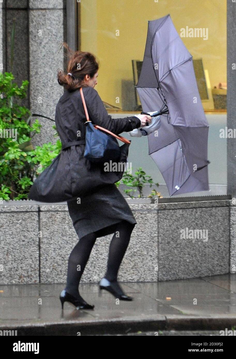 Heavy wind umbrella hi-res stock photography and images - Alamy